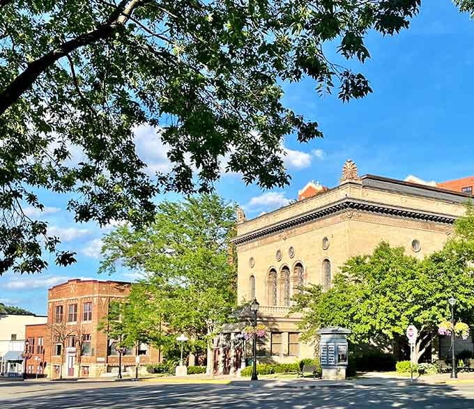 Tree-lined streets and classic architecture create scenes that belong on postcards celebrating authentic small-town American beauty.