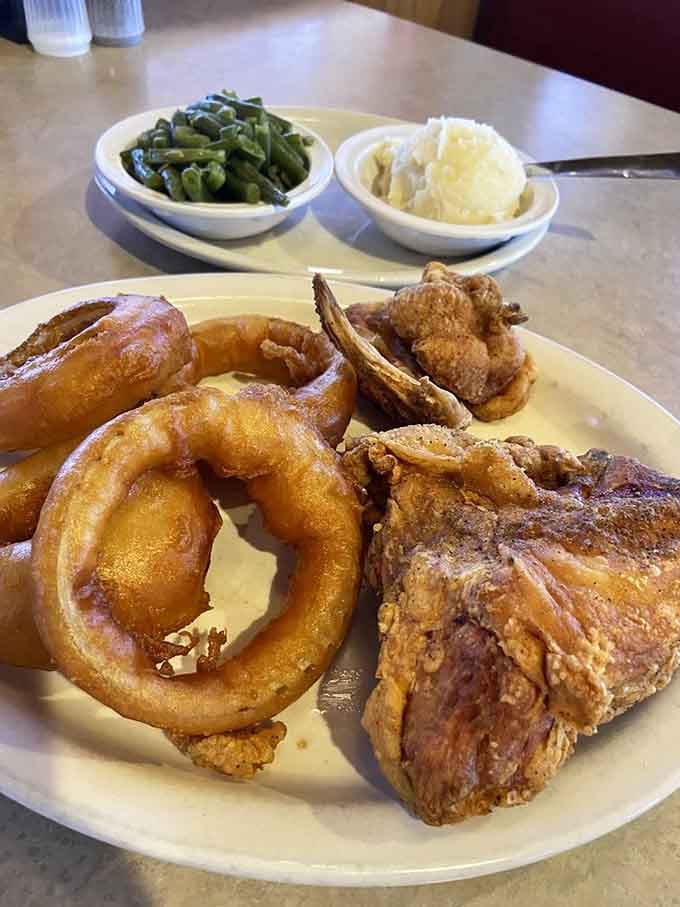 Golden fried chicken with those crispy onion rings and real mashed potatoes is comfort food that would make Colonel Sanders jealous.