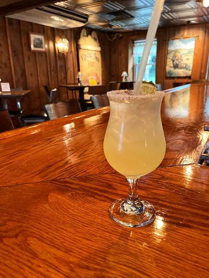 A margarita at the wooden bar where history and happy hour intersect beautifully every evening.