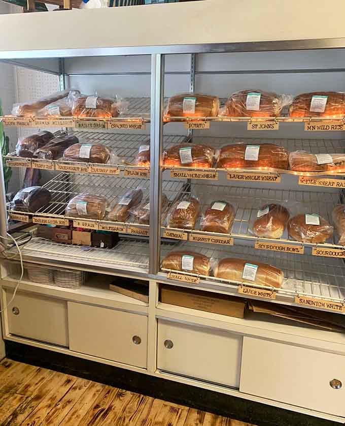 Shelves stocked with fresh-baked bread varieties, from potato to wild rice, because sandwiches deserve better than plastic-wrapped mediocrity.