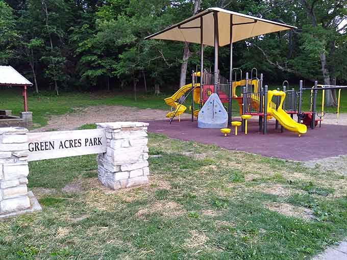Green Acres Park welcomes visitors with shade trees and playground equipment perfect for multigenerational afternoon adventures.