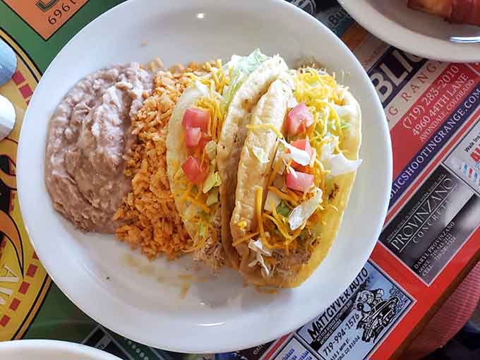 This taco plate proves that sometimes the best things in life come in crispy shells with generous toppings.