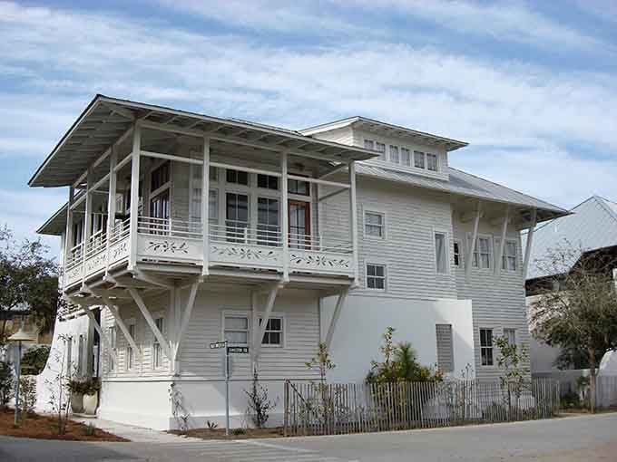 Elevated porches and coastal breezes combine in architecture that understands exactly what beachside living should feel like year-round.