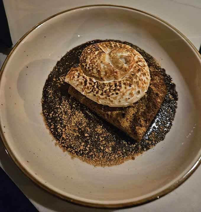 A s'more cake topped with toasted marshmallow that makes campfire desserts look positively primitive by comparison.