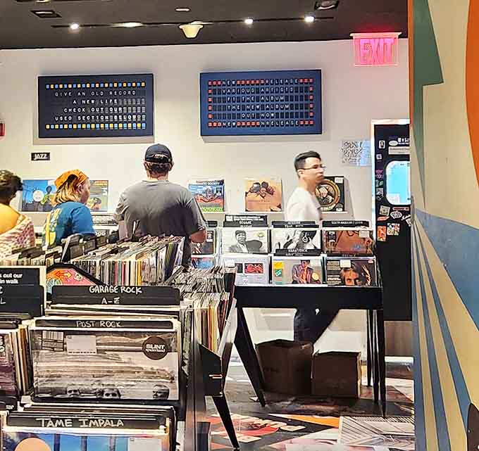 Real humans browsing real records, proving that some shopping experiences can't be replaced by clicking "add to cart."