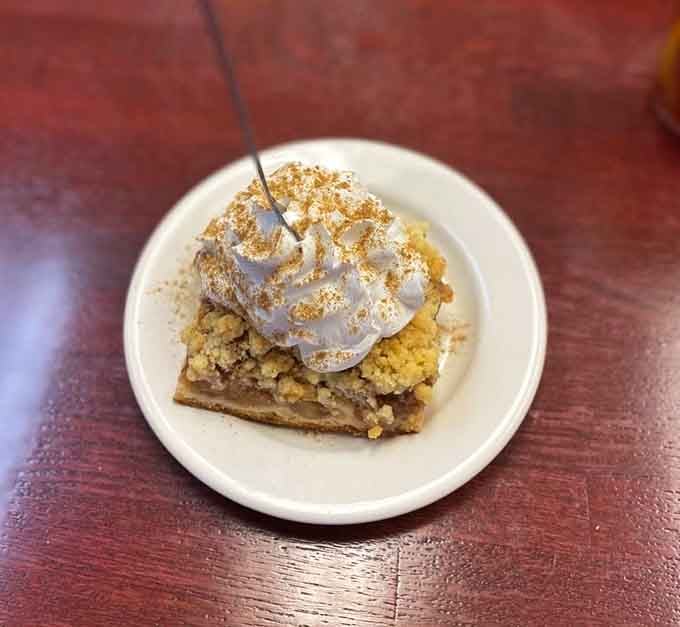 Apple crumble topped with enough whipped cream to make your cardiologist schedule an intervention, totally worth it though.