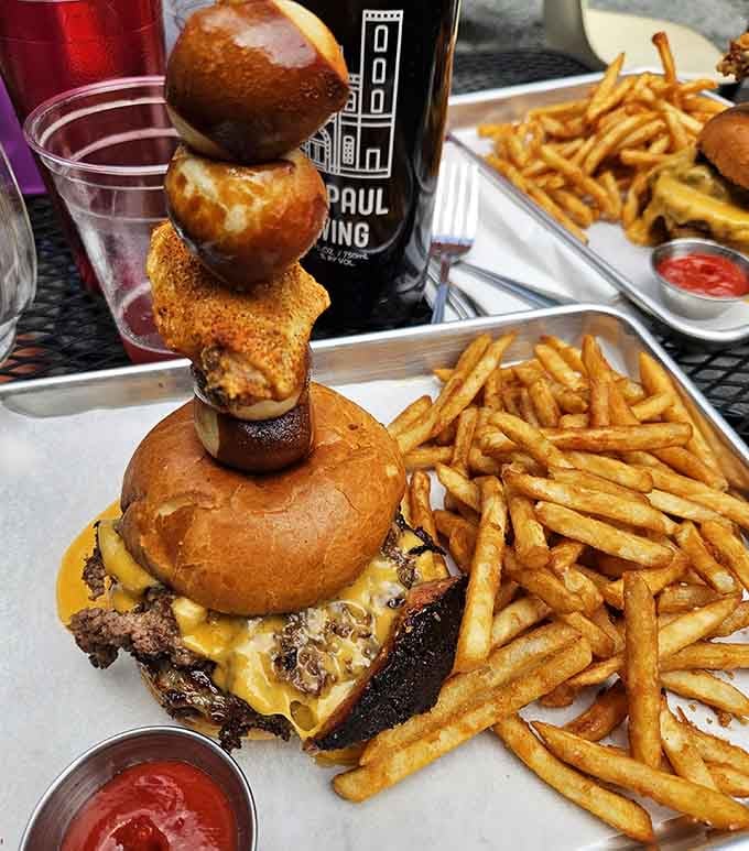 That burger tower defies gravity and common sense, but you're going to attempt it anyway, aren't you?