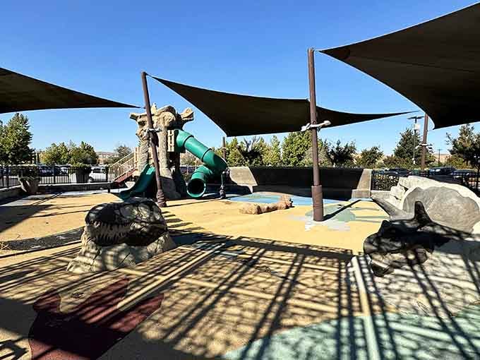 A playground where kids burn energy while parents mentally calculate how many more stores they can hit today.