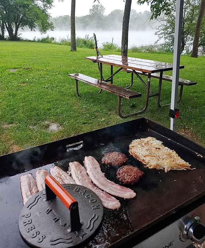 Morning mist rising off the water while breakfast sizzles, creating memories that smell better than any restaurant.