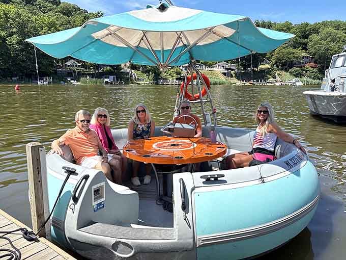 Floating picnic tables on the Kalamazoo River redefine waterfront dining with maximum whimsy and sunshine.