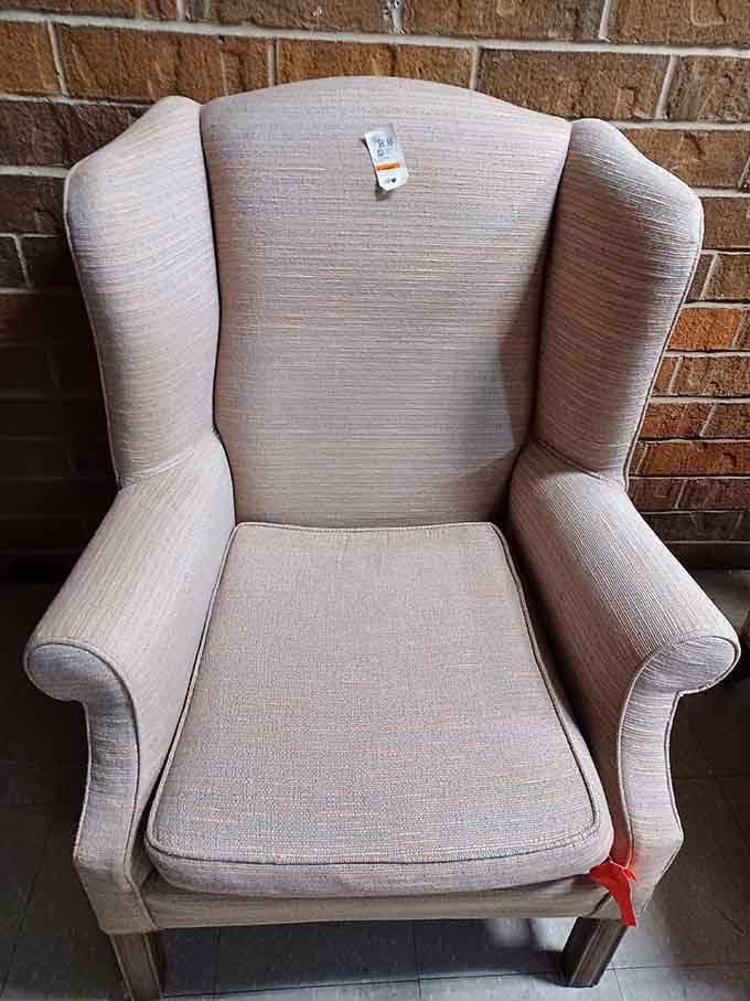 This wingback chair sits outside like it's contemplating retirement, but it's really just waiting for the right adopter.