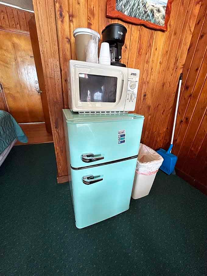 A retro mini-fridge in that perfect turquoise shade makes storing your beach snacks feel like a design statement.