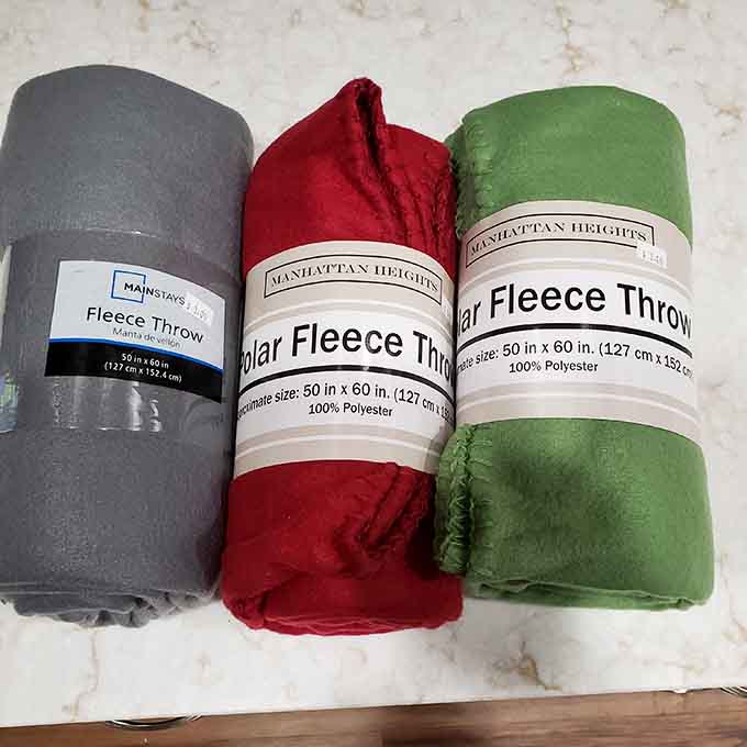 Brand new fleece throws still wrapped, because sometimes even thrift stores feel like regular retail therapy.