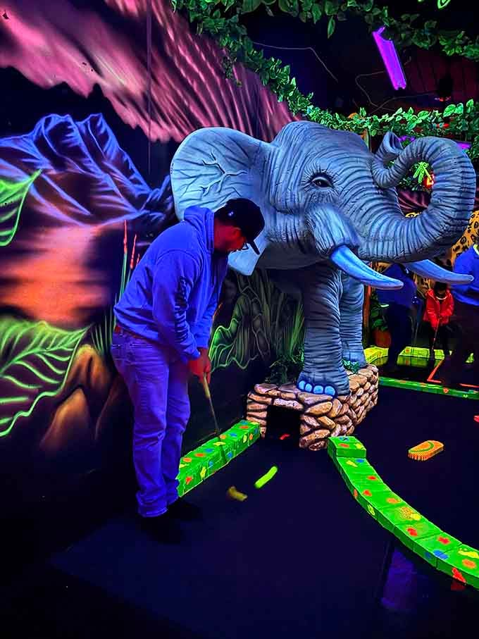 That elephant looks surprisingly majestic in electric blue, watching over golfers with the patience of a neon Buddha.