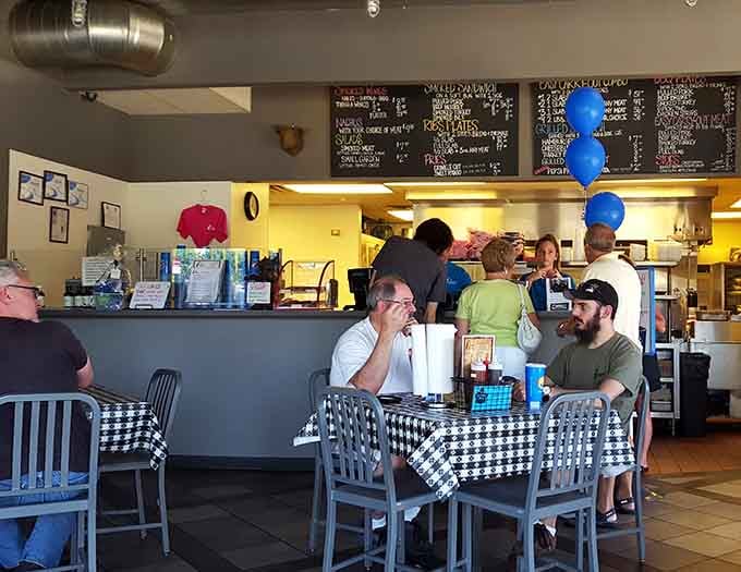 Diners enjoy their meals in a surprisingly peaceful atmosphere despite the facility's dual purpose nature.