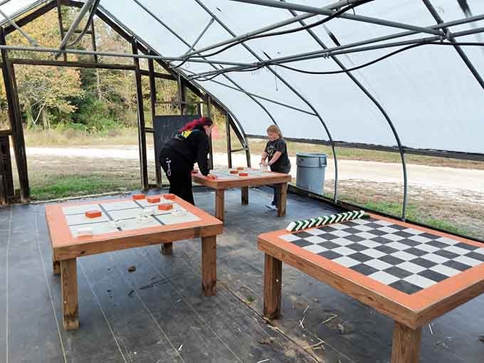 Oversized checkers and chess boards under shelter prove that entertainment doesn't require electricity or Wi-Fi to work.