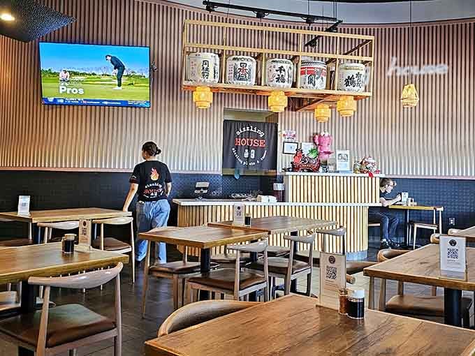 Sake barrels on the wall and TVs overhead create the perfect balance of traditional meets totally modern dining.
