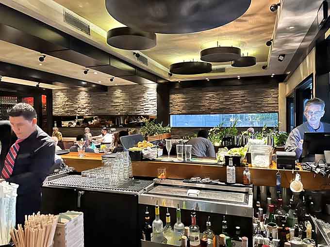 Spencer&rsquo;s Restaurant bar glows with warm lighting, skilled hands at work, and that polished California vibe perfect for unwinding after a long day.