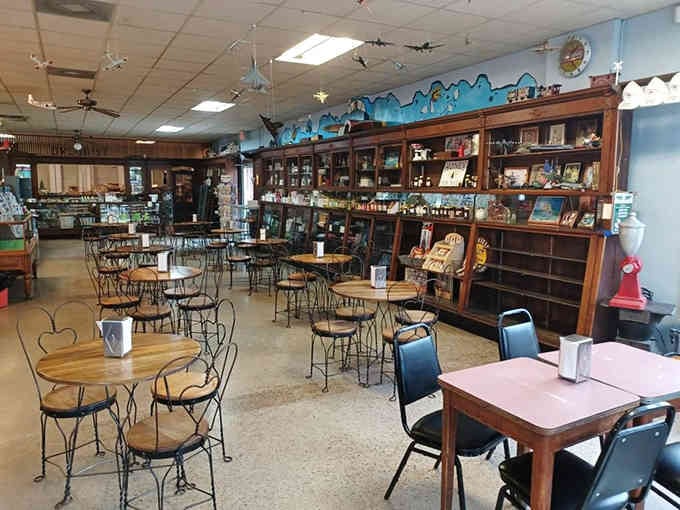 Turquoise walls and vintage shelving create an atmosphere that makes your smartphone feel suddenly very unnecessary.