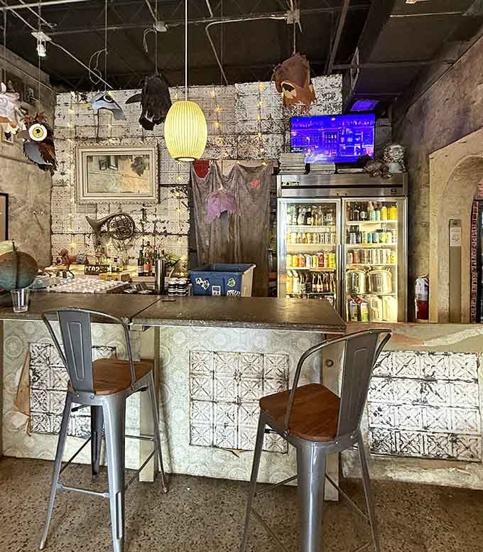 The counter area blends vintage charm with modern function, where decorative tiles meet practical service in perfect harmony.