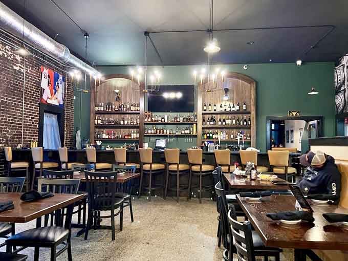 That bar setup with the arched shelving is giving serious "I could get used to this" vibes for happy hour.