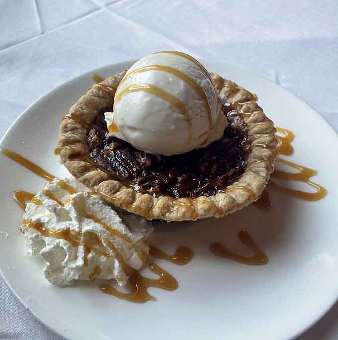 Pecan pie made in-house with ice cream and caramel, because buying desserts from suppliers is for restaurants without pride.