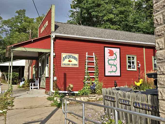 The Art Orchard Gallery's barn-red exterior promises creative treasures inside, with flowers adding splashes of seasonal color outside.