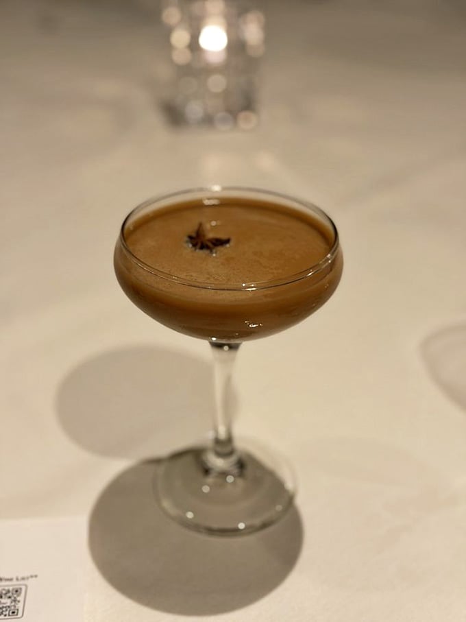 An espresso martini with a star anise garnish, for when coffee after dinner needs a promotion.