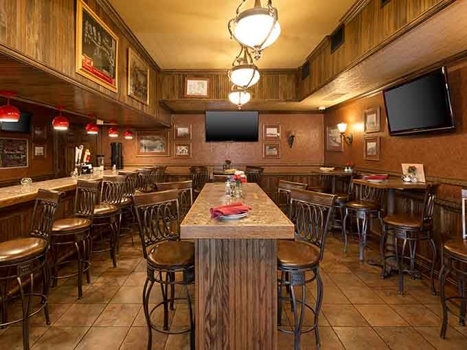 High-top seating and warm lighting create the perfect spot for casual drinks before your lakeside dinner begins.