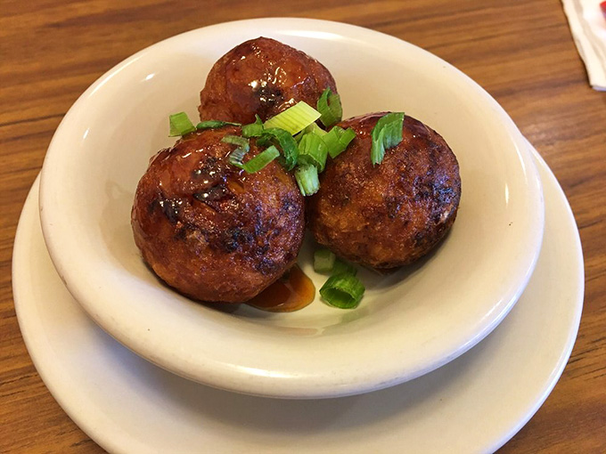 Takoyaki balls glazed to perfection, bringing a taste of Japanese street food to the heart of Downriver Michigan.