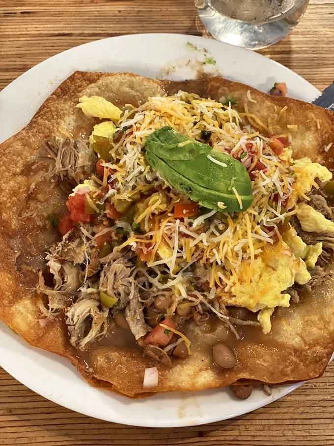 The Carnitas Supreme looks like a fiesta decided to crash breakfast, and everyone's thrilled about the unexpected party.