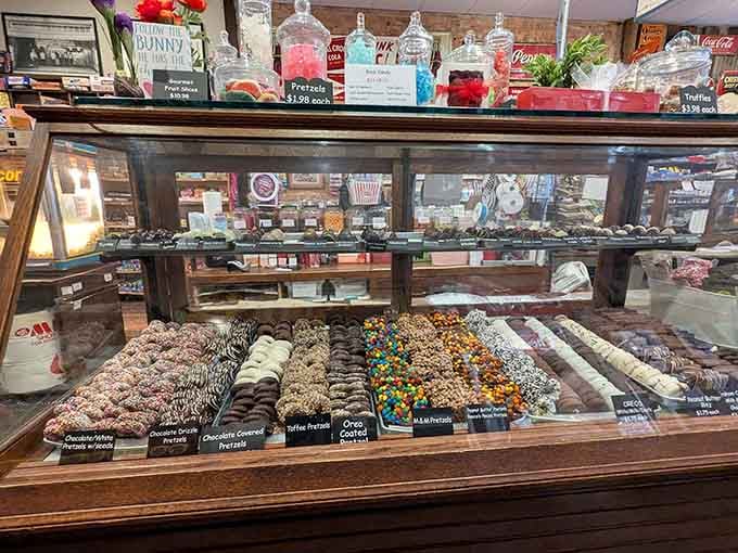 Rows of artisan chocolates gleam under the lights, each one whispering promises of caramel, nuts, and pure bliss.