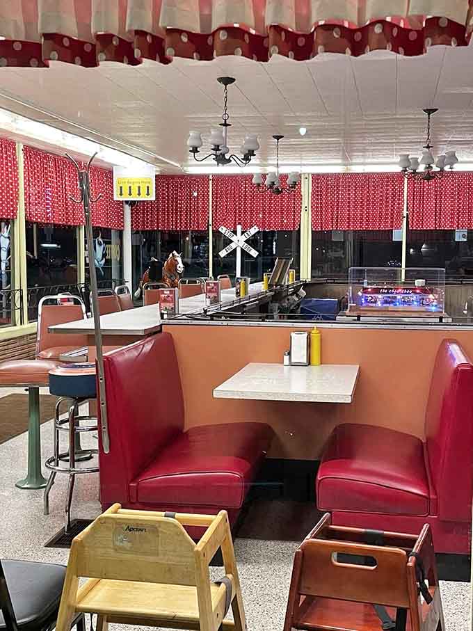 Polka-dot valances frame red booths and terrazzo floors, a 1950s time capsule that still serves lunch daily with style.