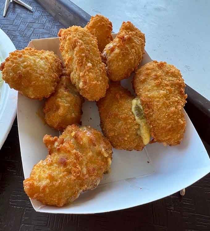 Jalape&ntilde;o poppers with that perfect golden crust, ready to clear sinuses and bring joy simultaneously.