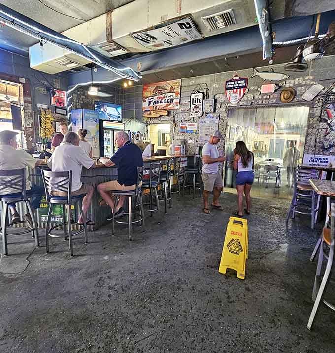 Dollar bills create an impromptu museum of memories, each one representing someone's perfect day at this beloved watering hole.