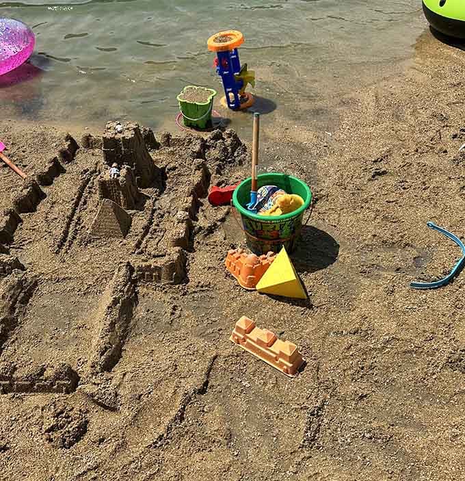 Sandcastle architecture at its finest, where young engineers practice their craft on genuine beach sand.