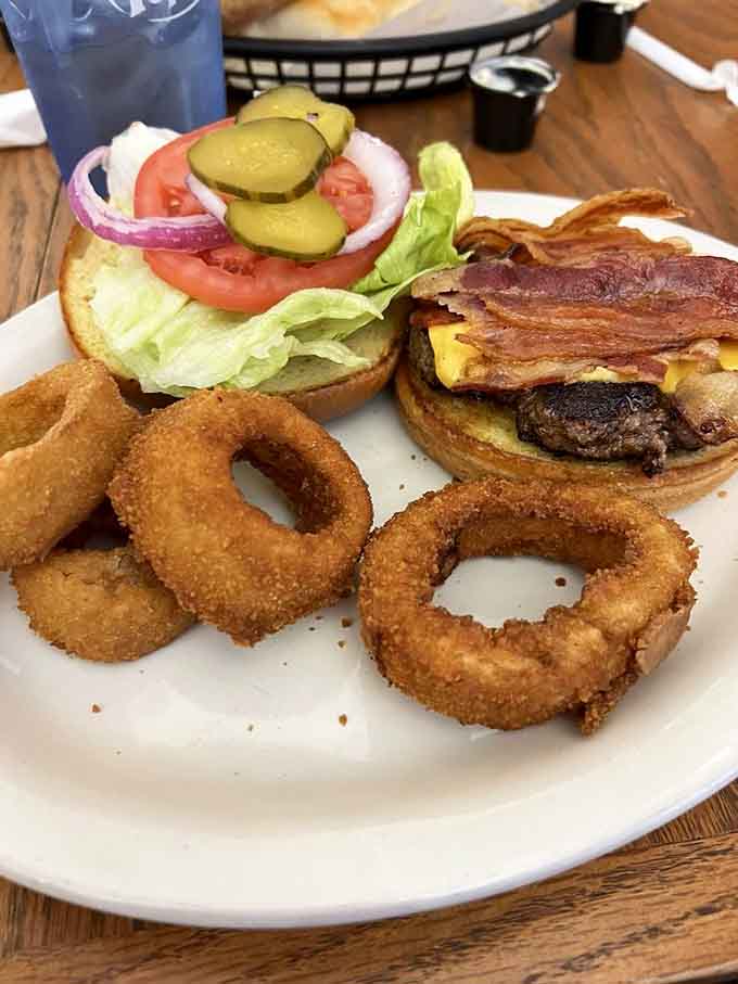 That bacon cheeseburger with golden onion rings is basically comfort food's greatest hits album on one glorious plate.