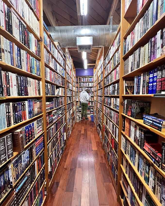 Floor-to-ceiling shelves stretch into infinity, a book lover's version of the yellow brick road.