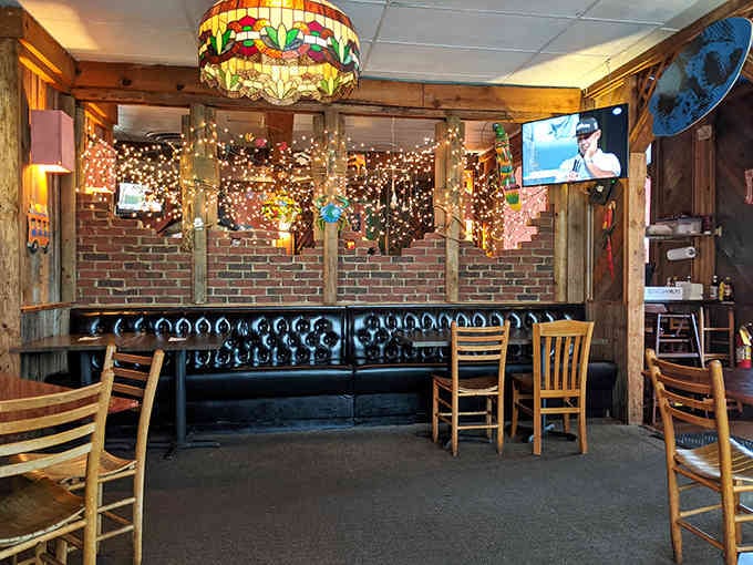 Twinkling lights and cozy booths create an atmosphere where time slows down and conversations flow freely.