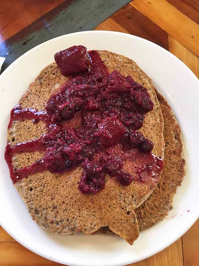 Buckwheat pancakes topped with berry compote: proof that healthy choices can still taste like pure weekend indulgence.