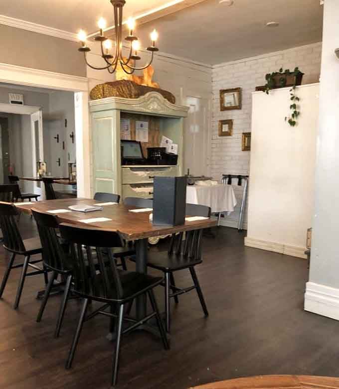 Multiple dining rooms flow together like chapters in a storybook, each one inviting you deeper in.