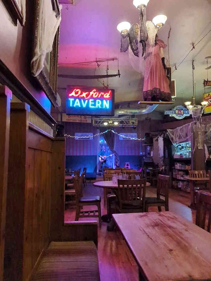 Vintage signs, period clothing, and neon glow create an atmosphere that's equal parts museum and neighborhood hangout spot.