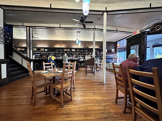 High ceilings and colorful pendant lights add visual interest without overwhelming the space's historic charm and character throughout.