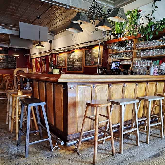 The bar gleams with possibility, lined with stools where locals gather to debate life over perfectly poured pints.