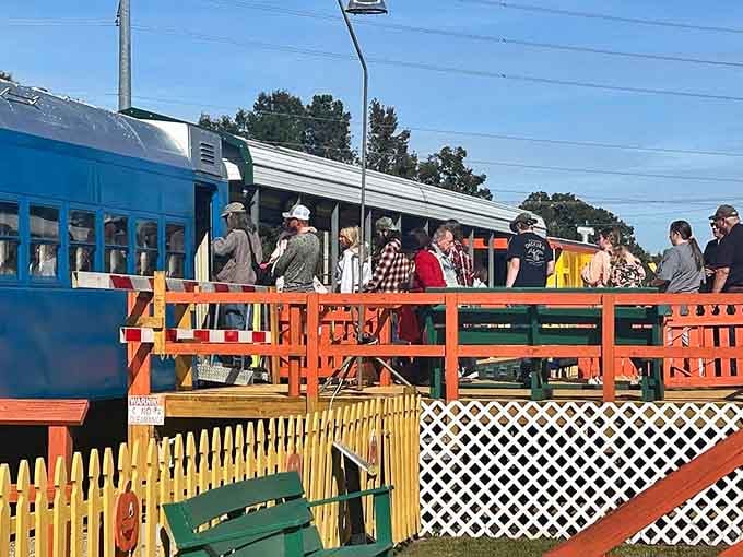 Passengers gather on the platform like extras in a feel-good family film about simpler times and slower journeys.