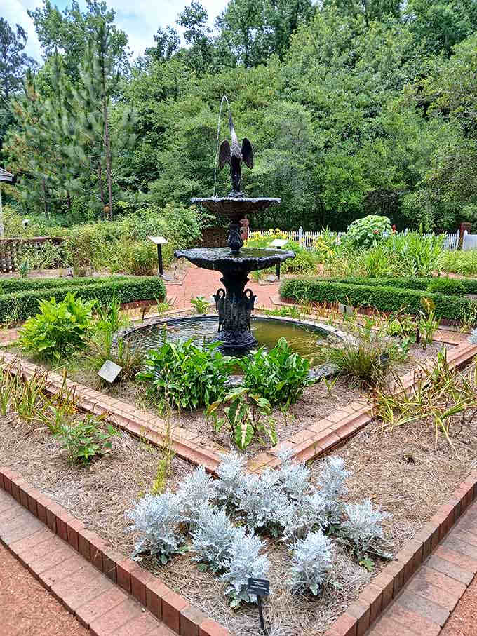 This ornate fountain serves as the garden's centerpiece, where water dances and visitors pause to appreciate timeless elegance.