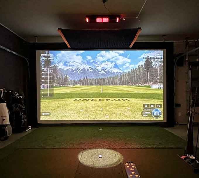 Virtual fairways and mountain views combine for an indoor golf experience that beats fighting actual sand traps any day.