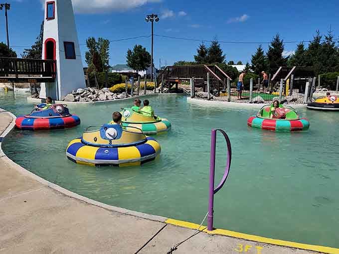 Bumper boats circle like colorful sharks, ready for aquatic combat that leaves everyone soaked and grinning wildly.