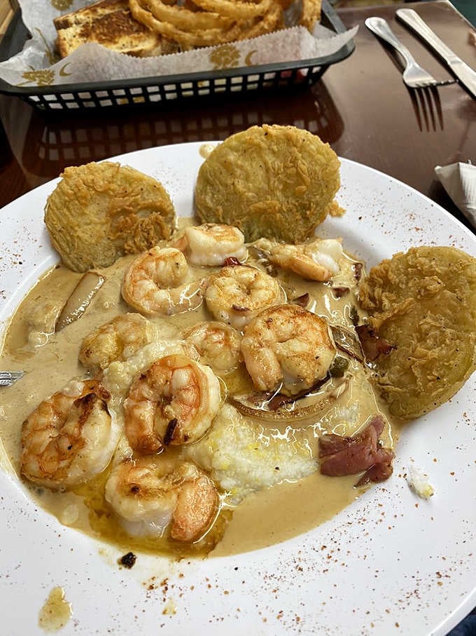 Plump shrimp nestled in creamy grits with golden fried biscuits is Lowcountry cooking that'll make your taste buds sing.