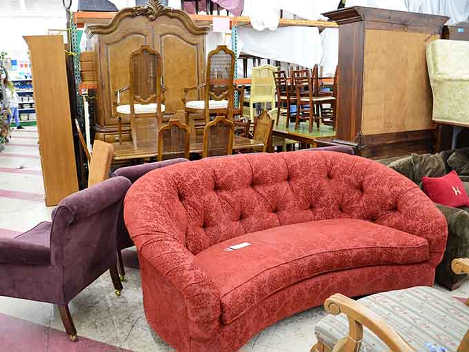 That tufted sofa is giving serious vintage Hollywood vibes, just waiting for its comeback story in your home.